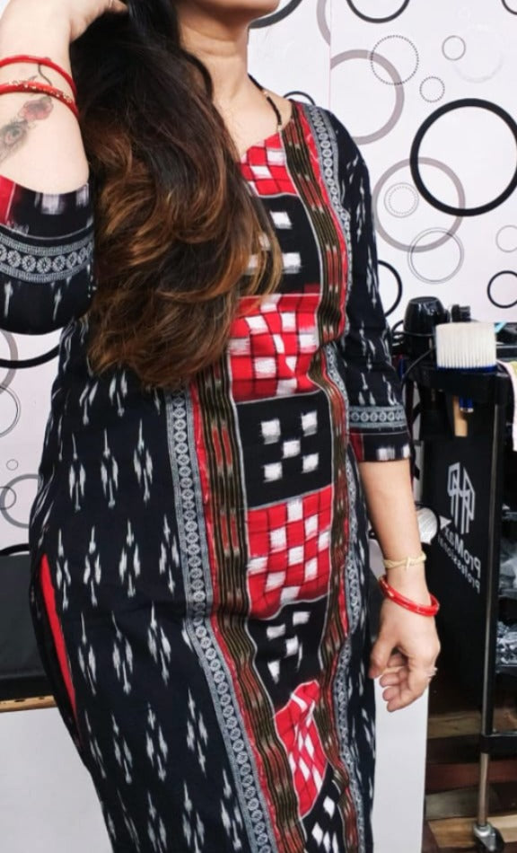 This red and black cotton dress features a traditional Pasapali patter